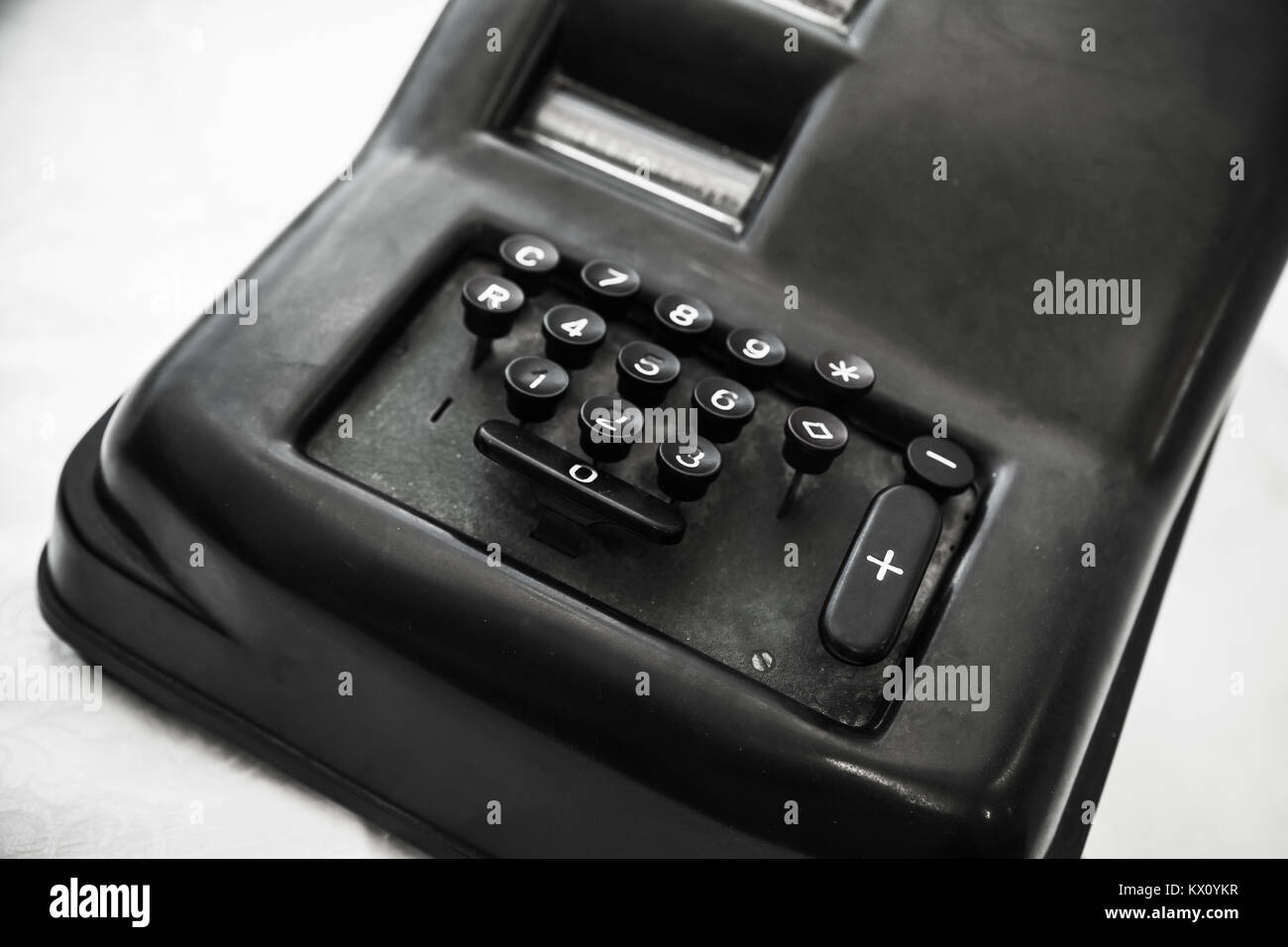 Vintage mechanical calculator, closeup photo with selective soft focus ...