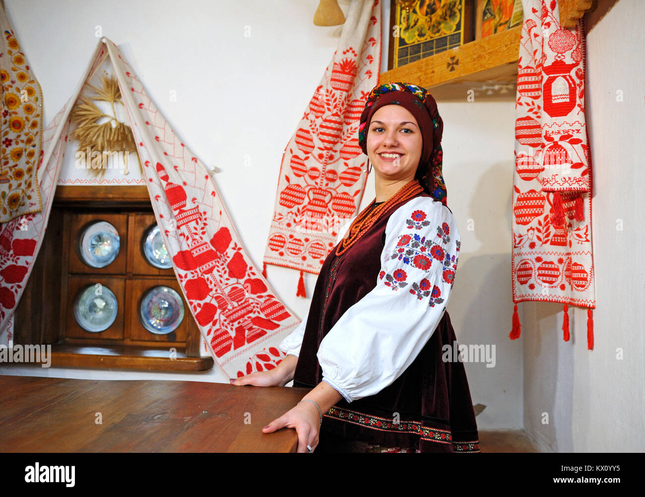 Woman in Ukrainian native dresses standing behind table to celebrate ...