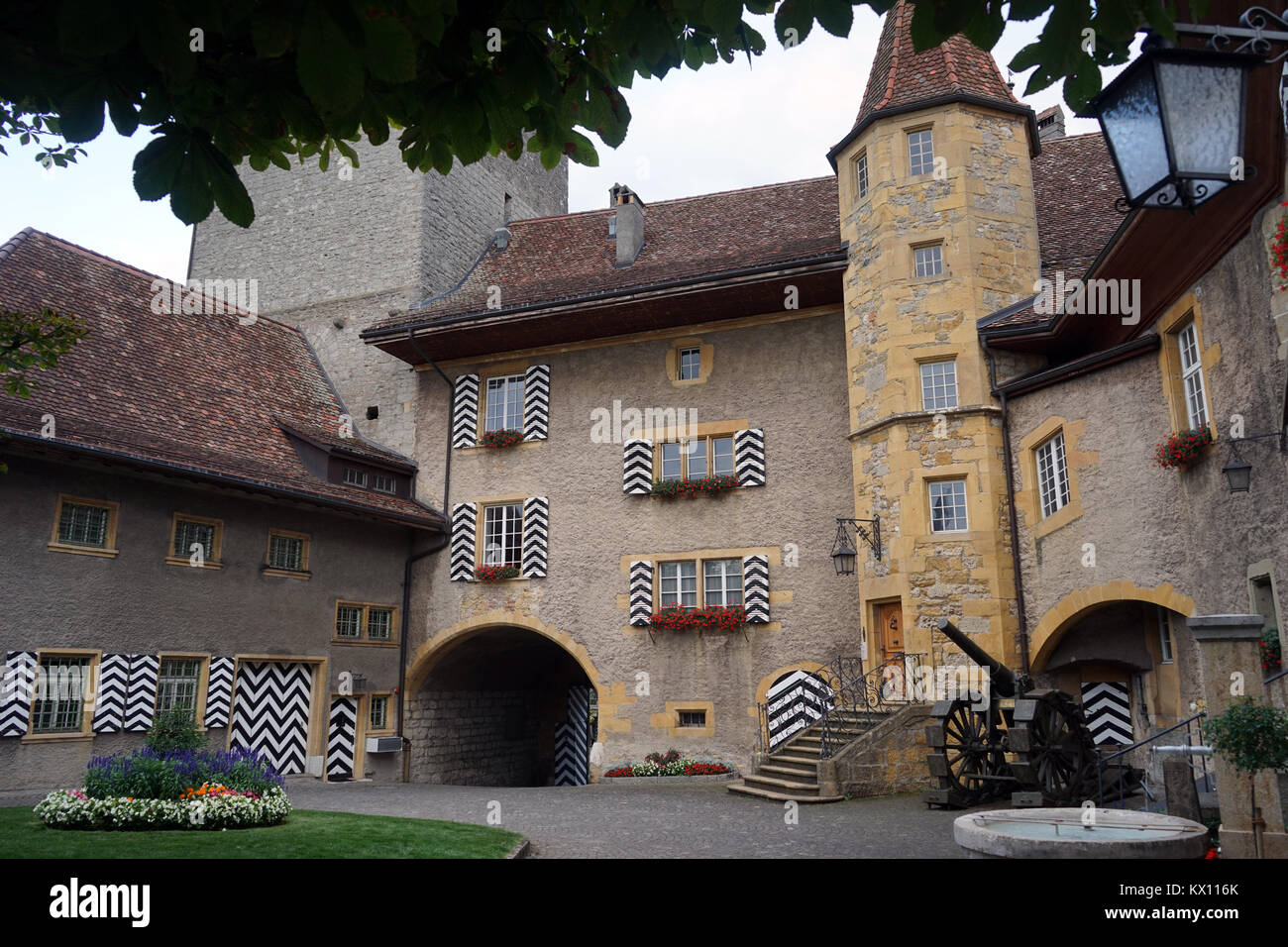MURTEN, SWITZERLAND - CIRCA AUGUST 2015 Fountain and old gun in the ...