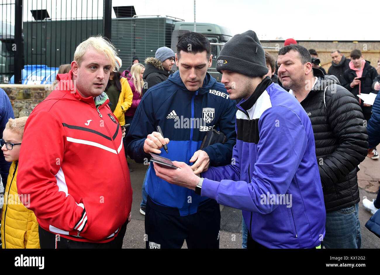 West Bromwich Albion's Gareth Barry (centre) signs autographs for fans ...