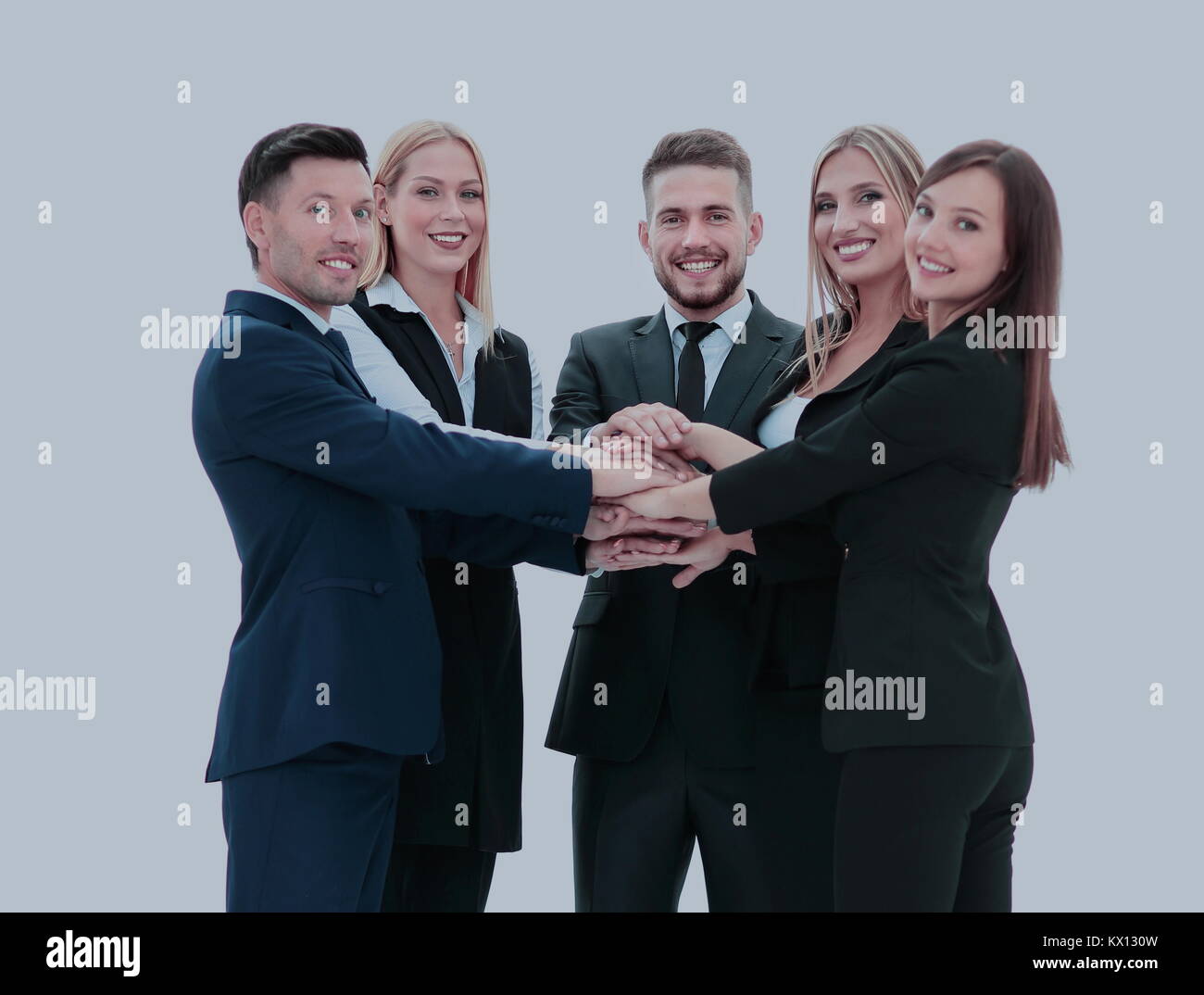 Business team showing unity with their hands together Stock Photo - Alamy