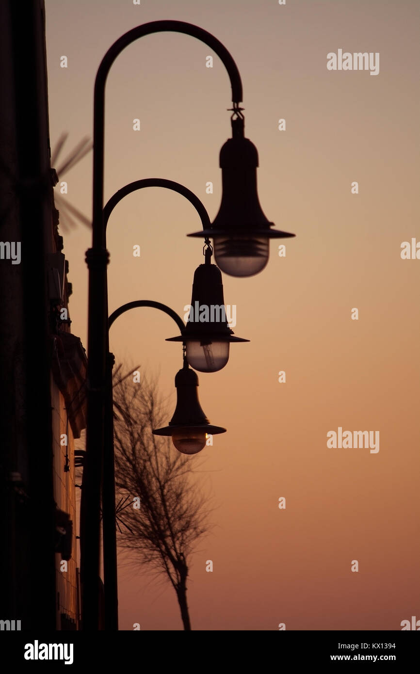 Retro streetlights and evening golden sky mood background Stock Photo ...