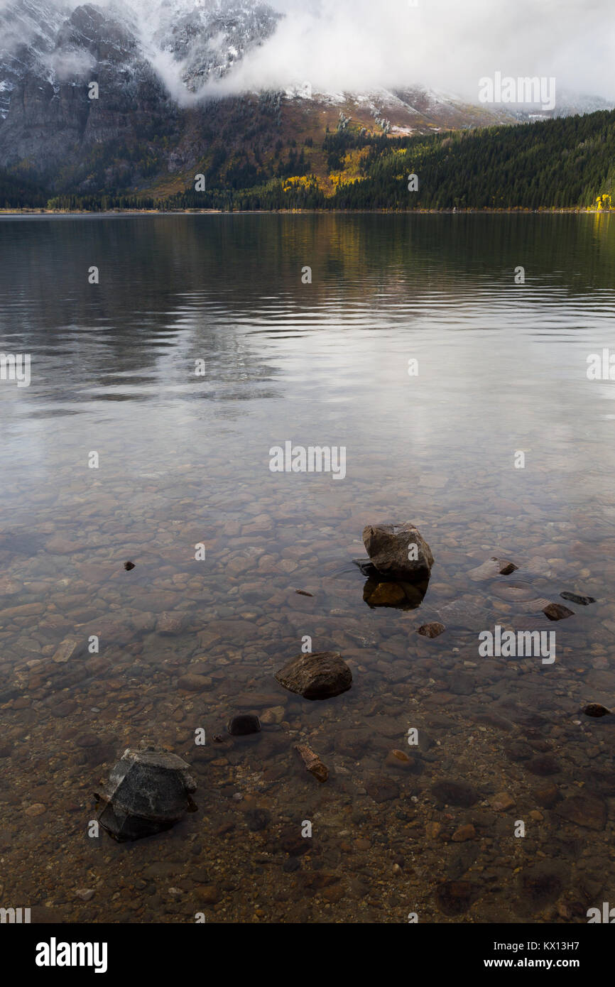 The shallow waters along the shores of Phelps Lake allowing rocks to ...