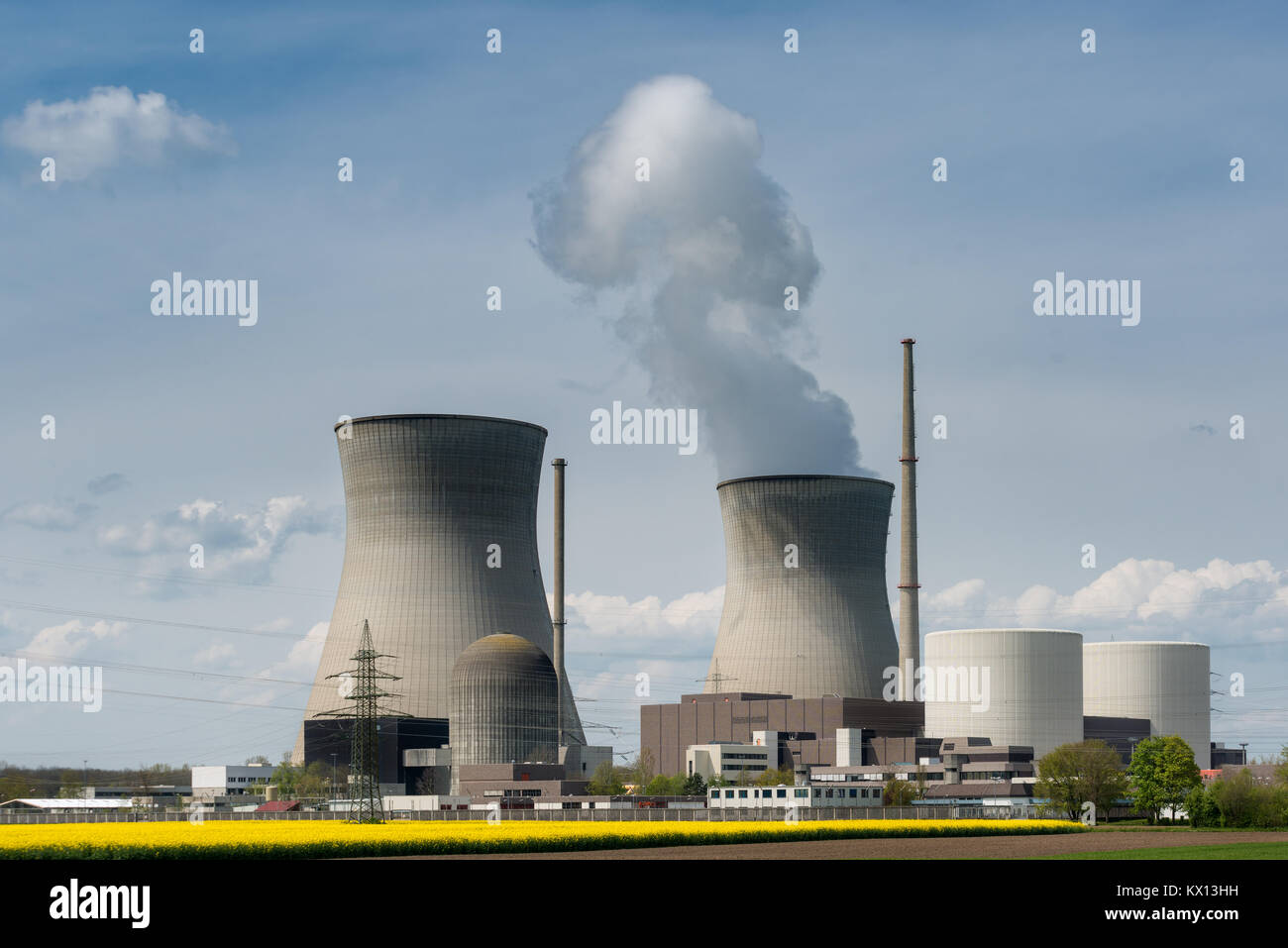 Nuclear power plant with yellow field and big blue clouds Stock Photo ...