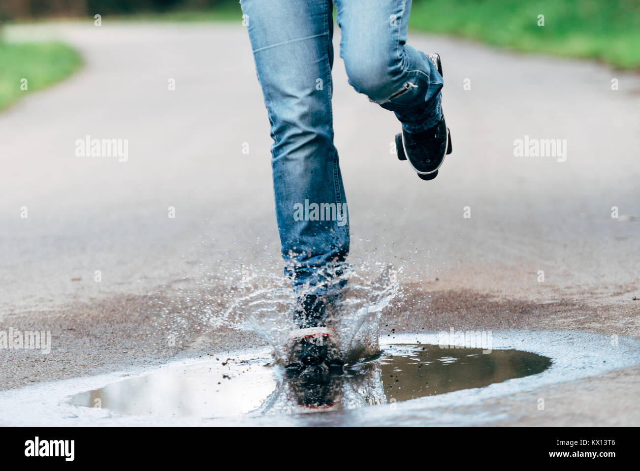 Splashing in a puddle hi-res stock photography and images - Alamy