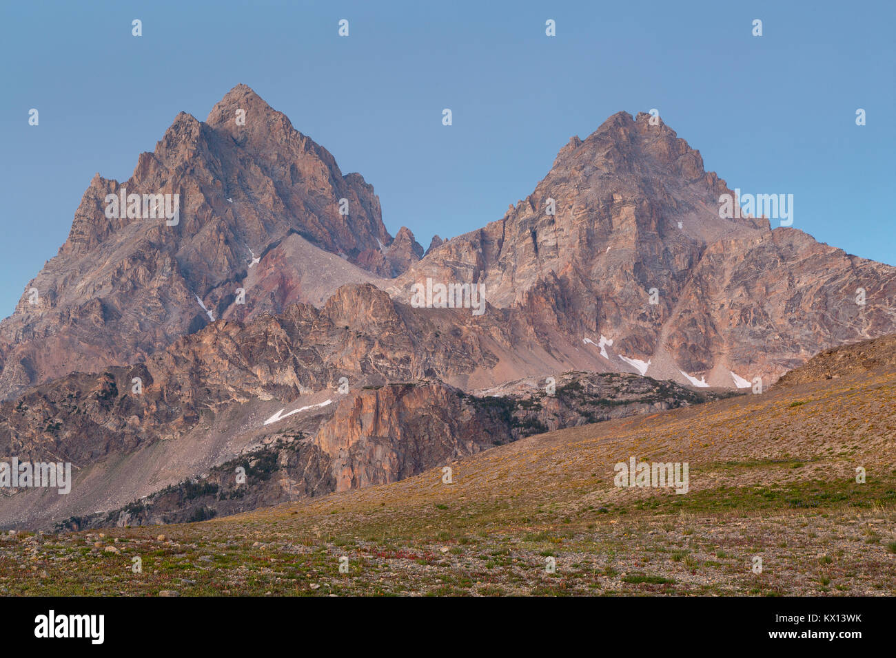 Hurricane Pass sloping below the Grand and Middle Teton peaks of the ...
