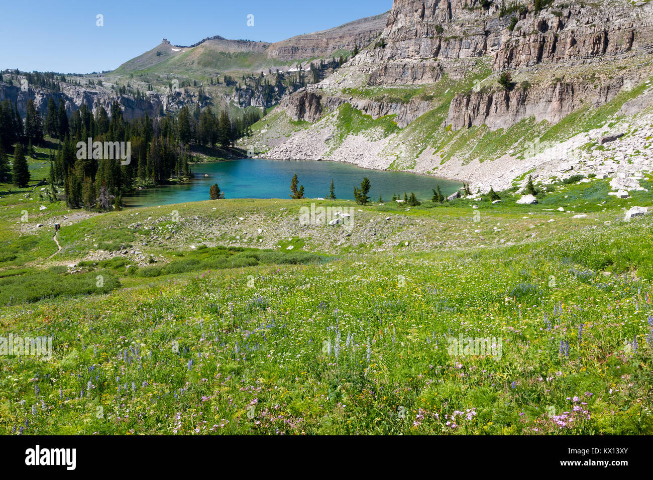 Marion Lake, at the top of Granite Canyon, glowing below large peaks in ...