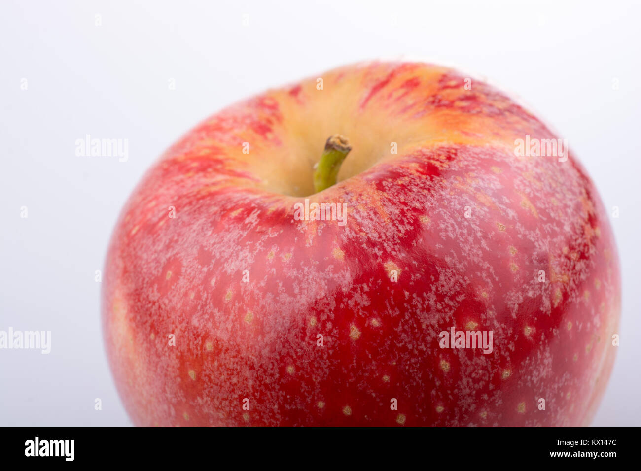 Red apple with dots in close up view Stock Photo - Alamy