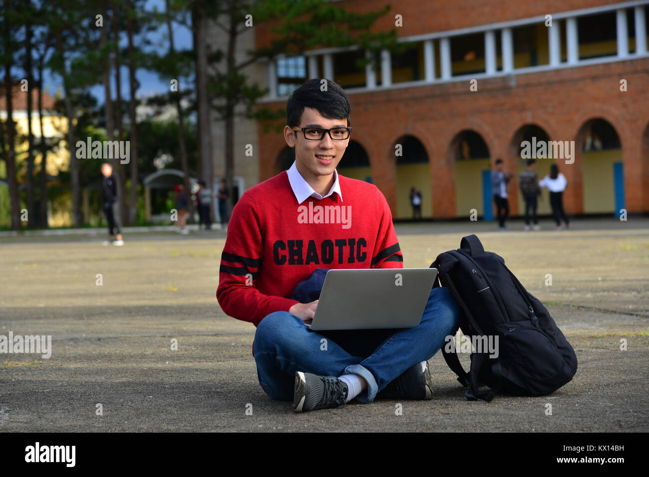 A young student using laptop computer at an old college Stock Photo - Alamy