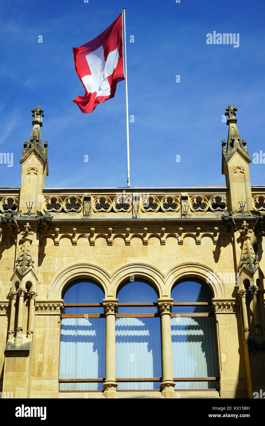 NEUCHATEL, SWITZERLAND - CIRCA JULY 2015 Swiss flag on the Neuchatel ...