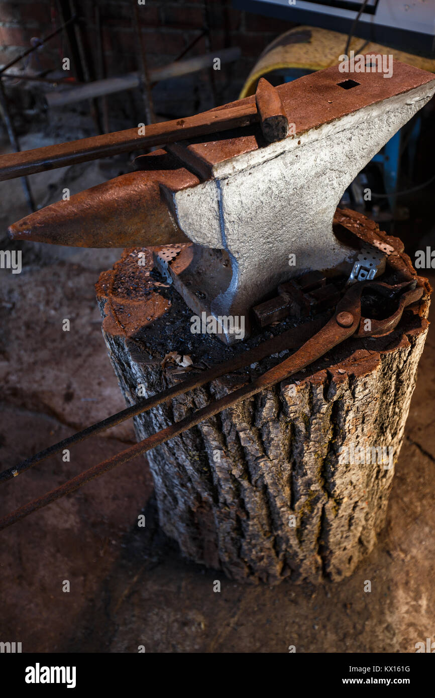 Hand anvil. Tools in old blacksmith shop Stock Photo - Alamy