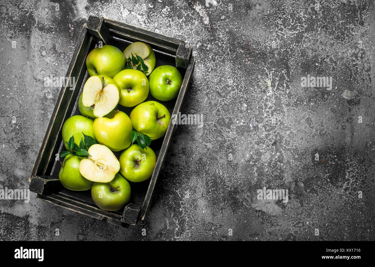 Green apples in an old box. On a rustic background Stock Photo - Alamy
