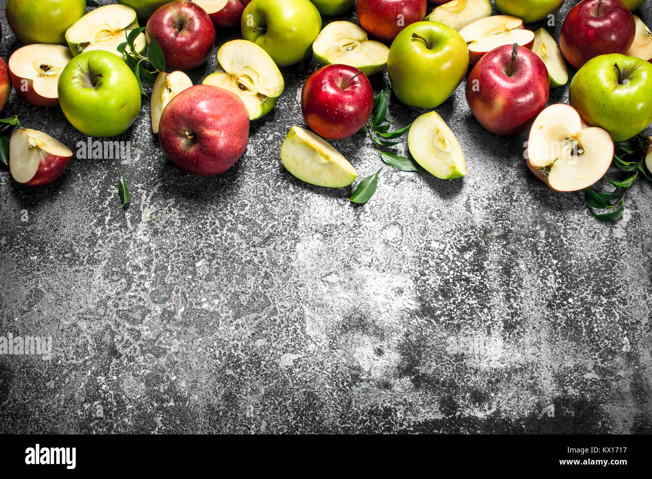 Red and green apples. On a rustic background Stock Photo - Alamy