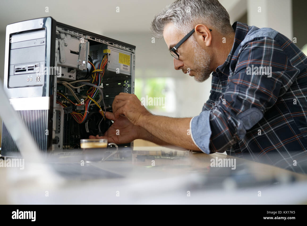 Technician repairing computer hardware Stock Photo - Alamy