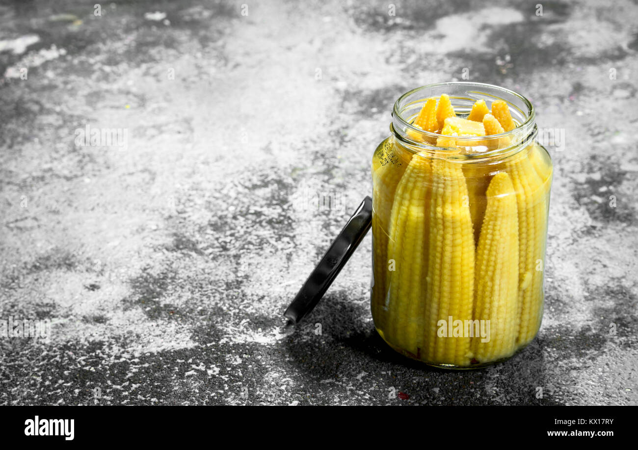 Marinated corn in glass jar. On a rustic background Stock Photo - Alamy