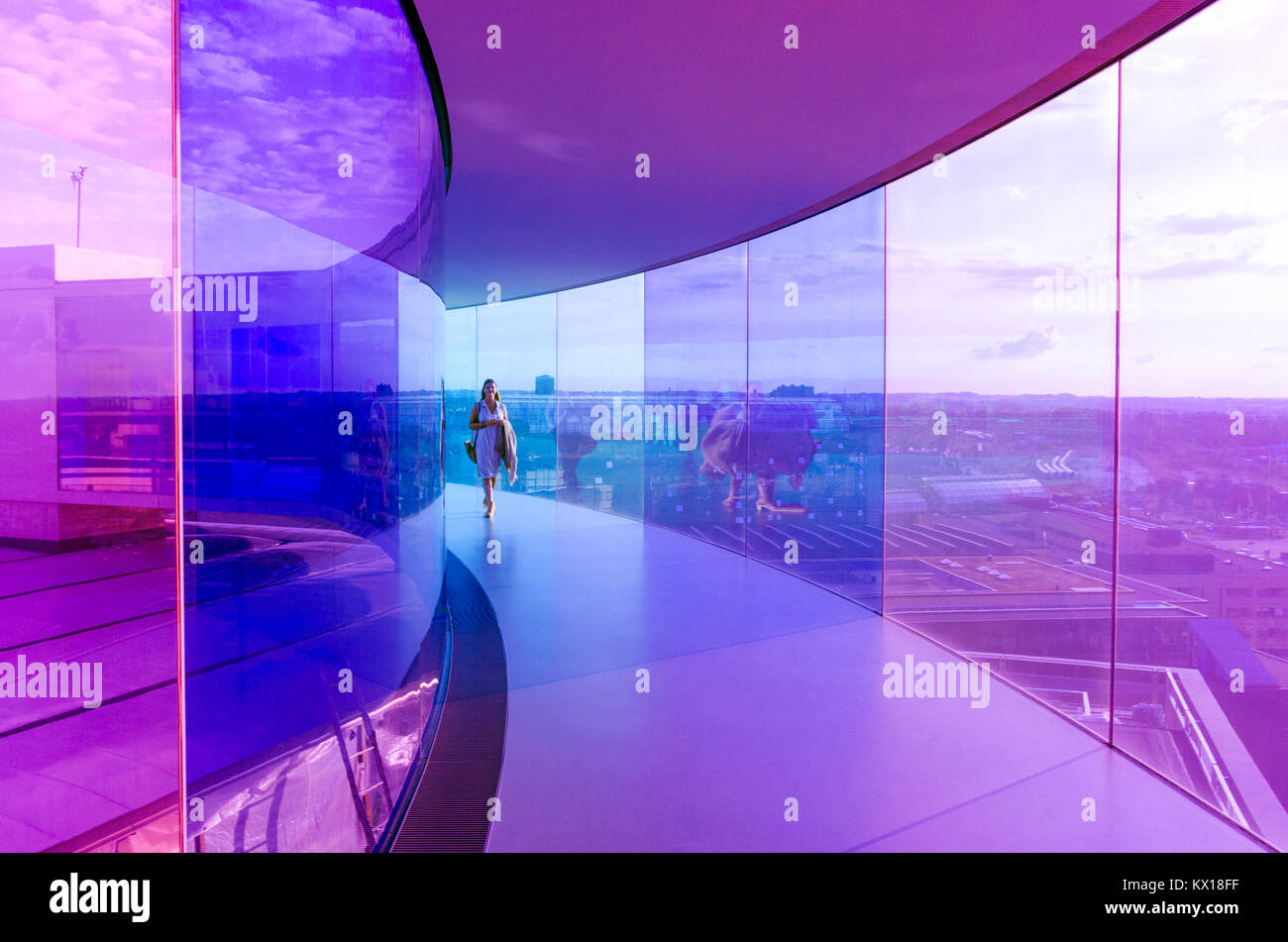 Visitors enjoy Your Rainbow panorama of Aarhus at Aros Art Museum. The ...