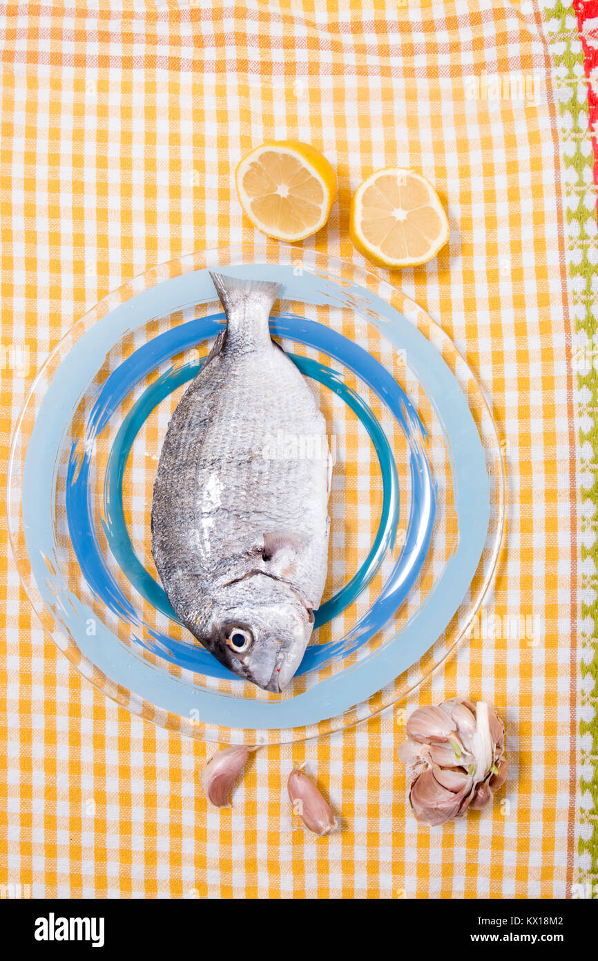 Gilt-head bream fish on a plate Stock Photo - Alamy