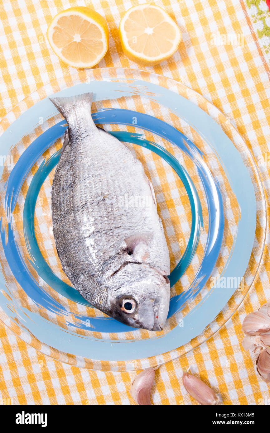 Gilt-head bream fish on a plate Stock Photo - Alamy