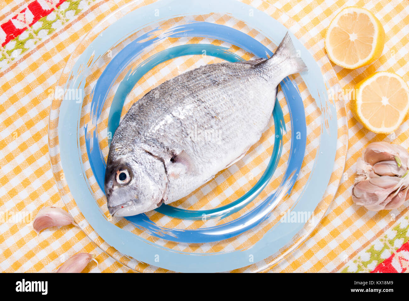 Gilt-head bream fish on a plate Stock Photo - Alamy