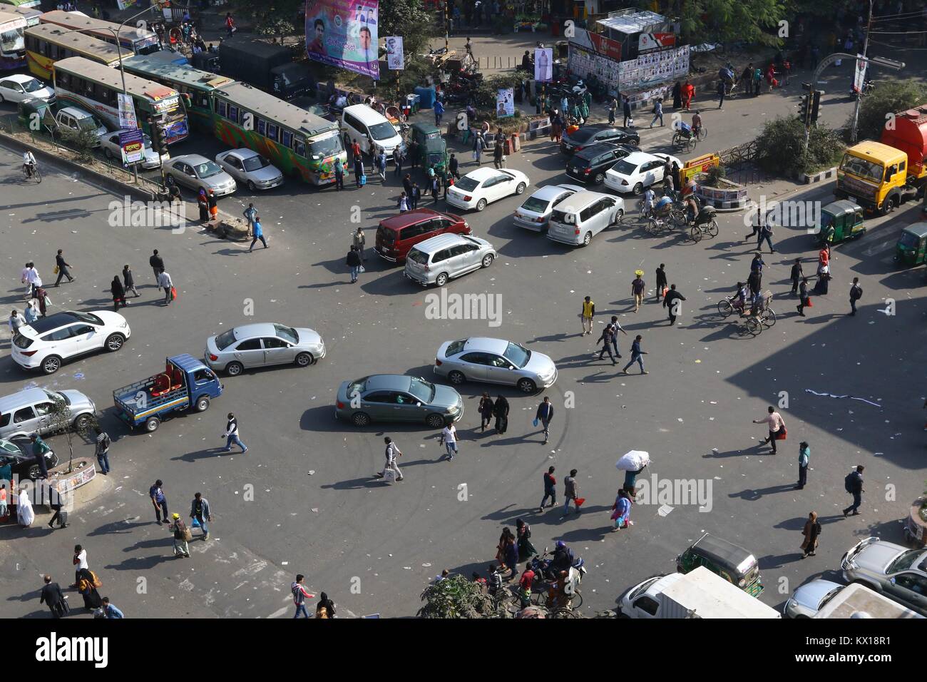 Street car traffic and crowd of people walking Across Busy Road in ...