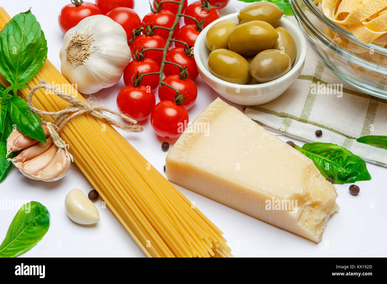Fettuccine and spaghetti, vegetables with ingredients for cooking pasta ...