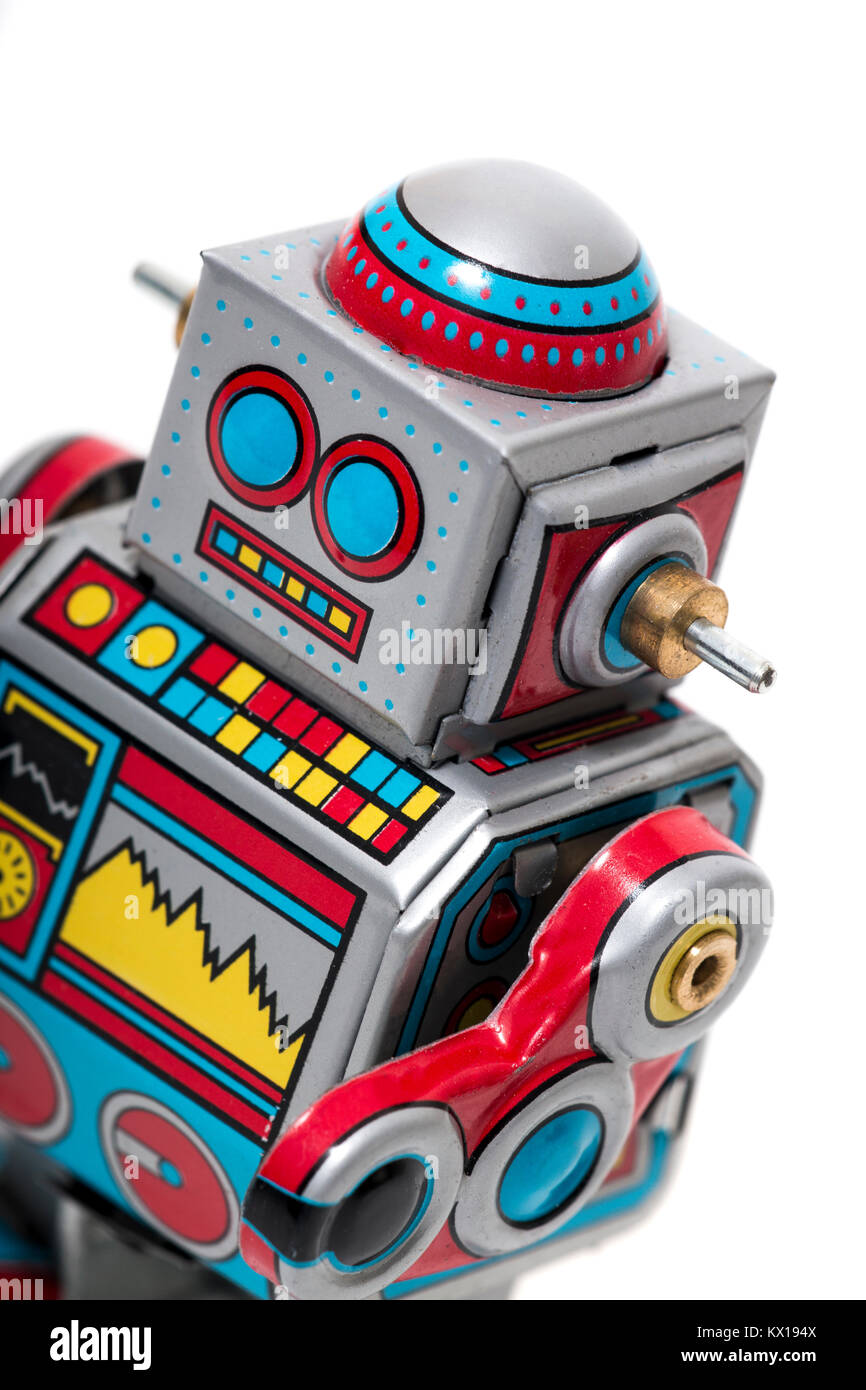 Vintage tin robot toy isolated on a white background Stock Photo - Alamy