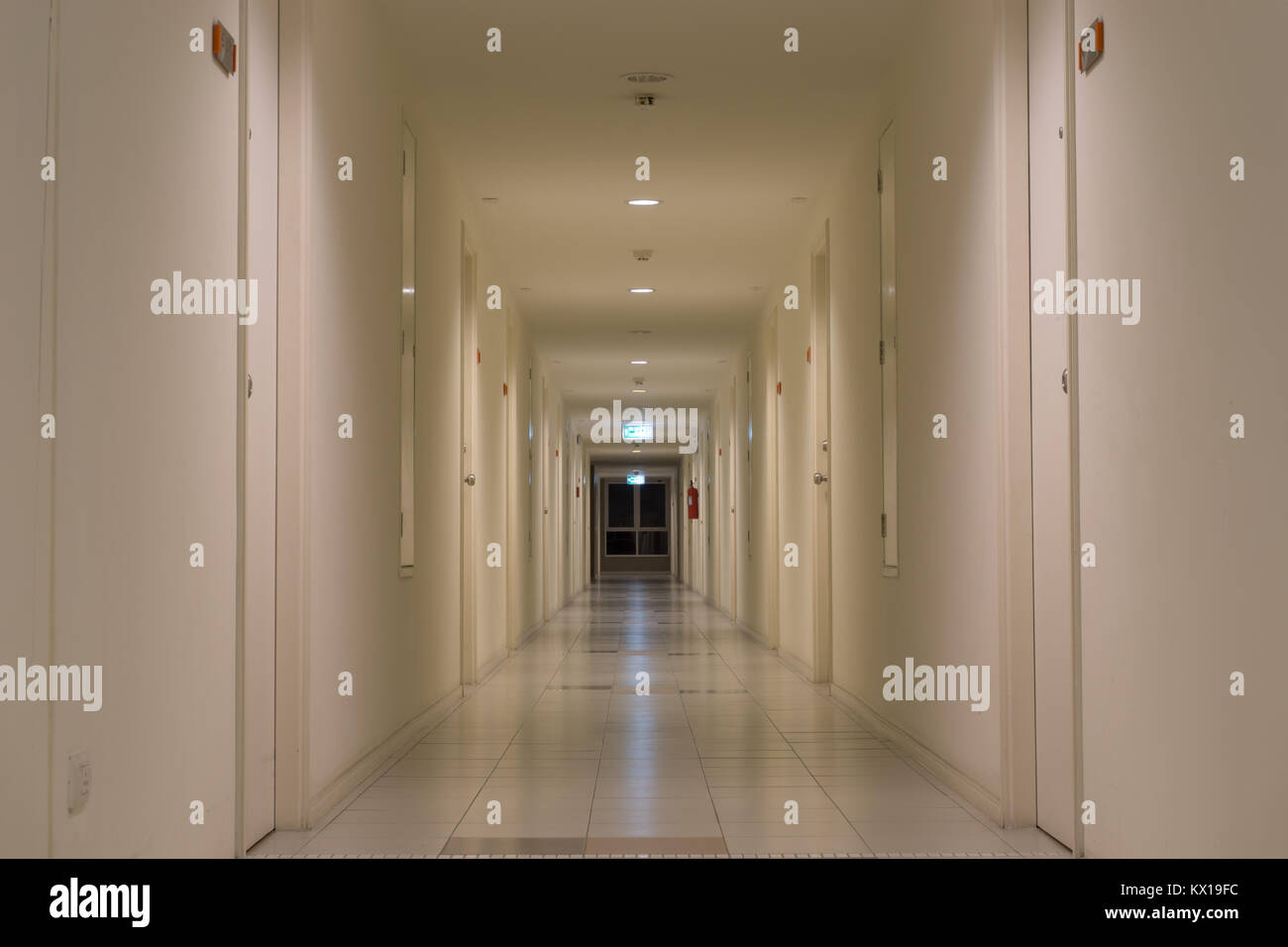 Walkway without people inside living apartment and fire escape sign ...