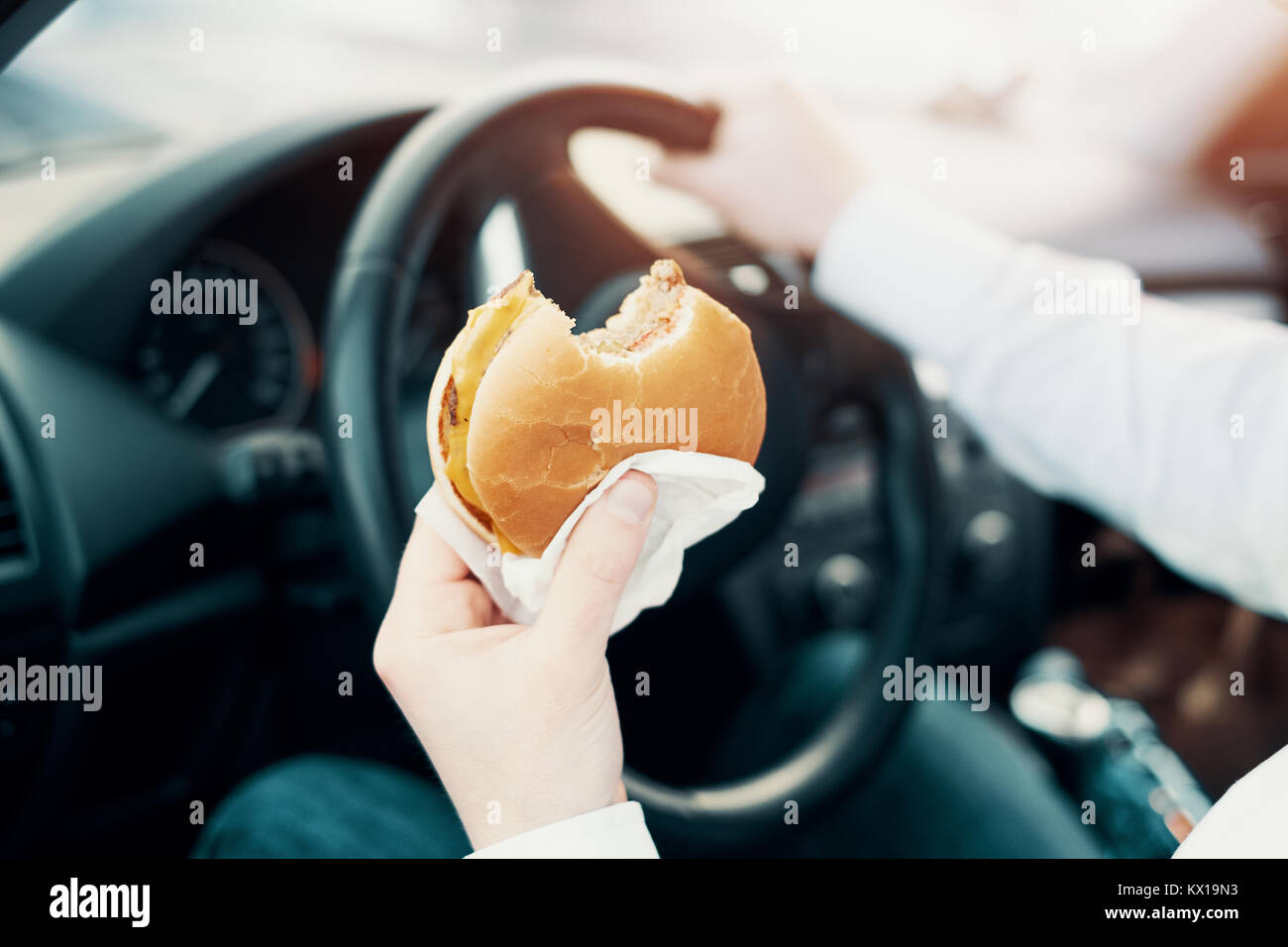 Man eating burger hurry hi-res stock photography and images - Alamy