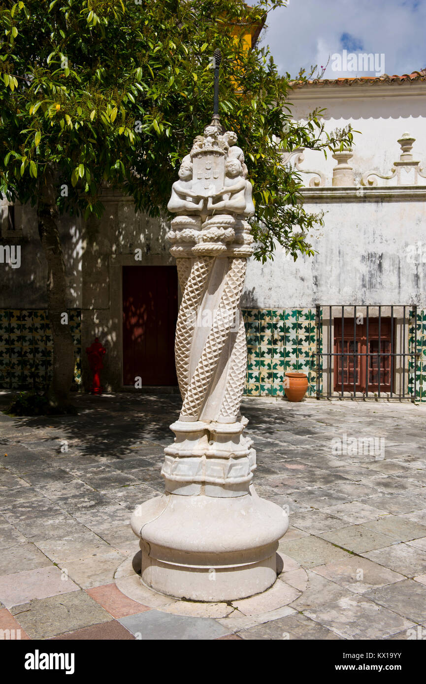 A decorative column in a small courtyard at the Palace of Sintra which ...
