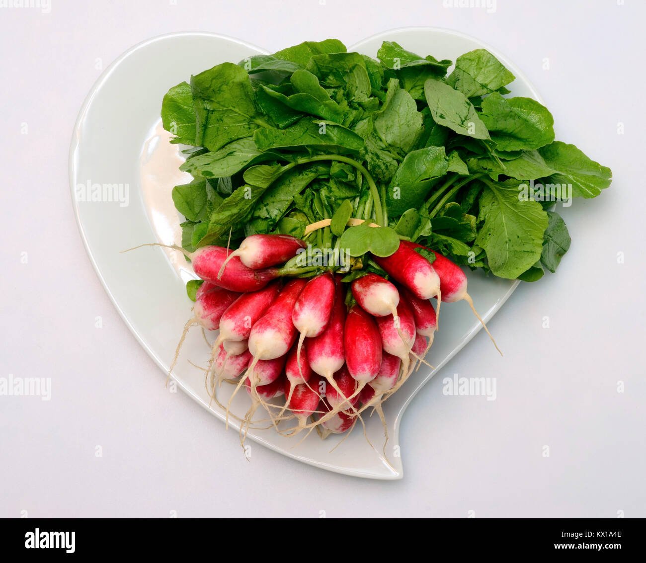 bunch of radishes on heart shape plate, heathy food Stock Photo - Alamy