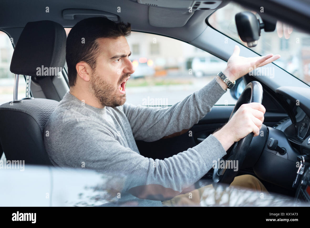 Face expression of angry driver arguing and gesturing Stock Photo - Alamy