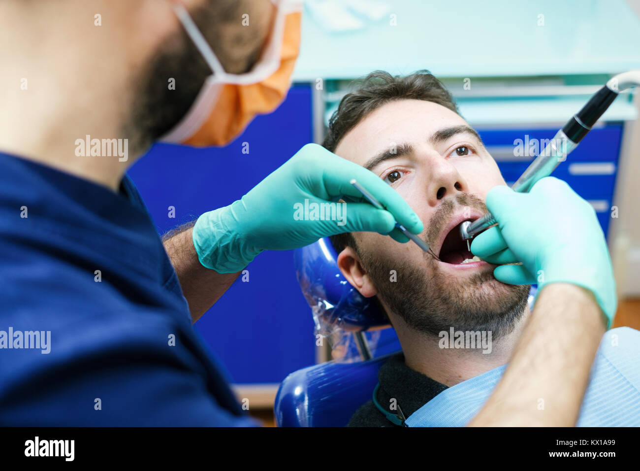 Dentist examining patient's teeth in clinic Stock Photo - Alamy