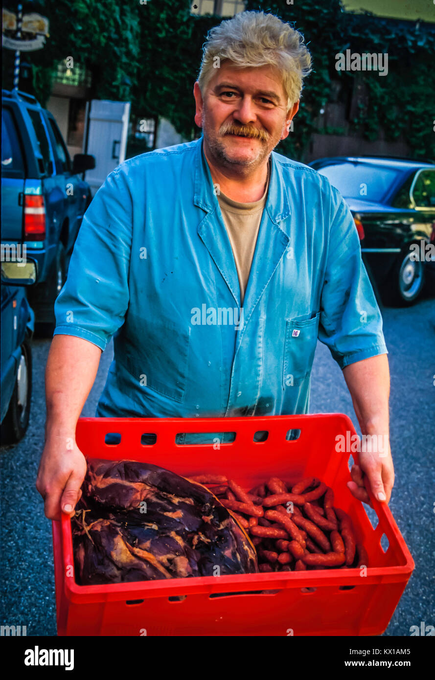 Germany, street scenes with people. Butcher delivering sausages Stock ...