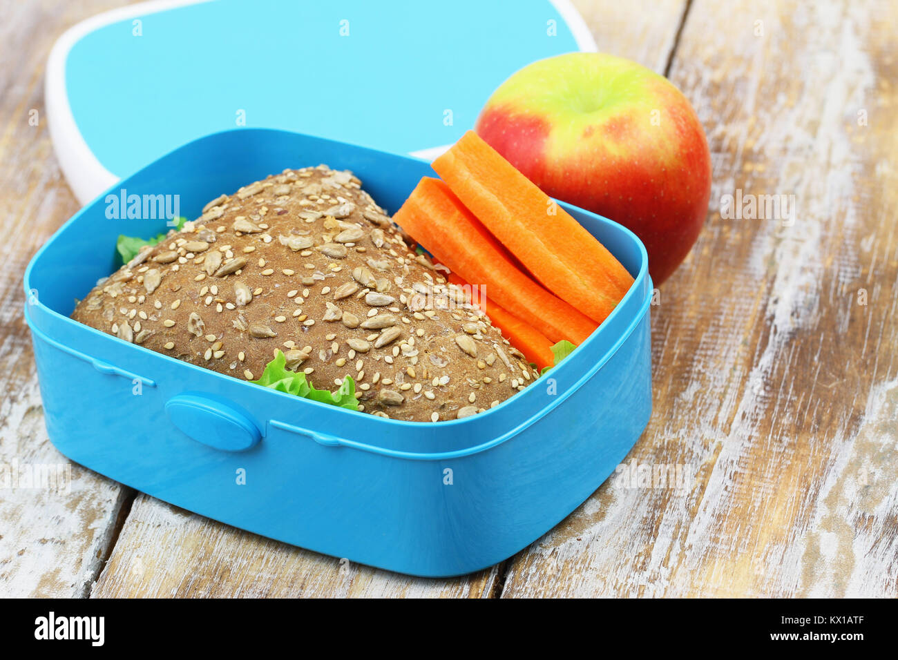 Healthy packed lunch box containing brown cheese sandwich, crunchy ...