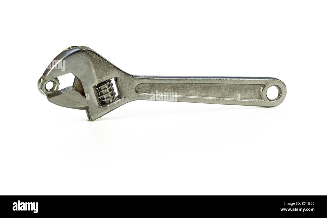 On a white background a metal adjustable wrench clamps a nut Stock ...