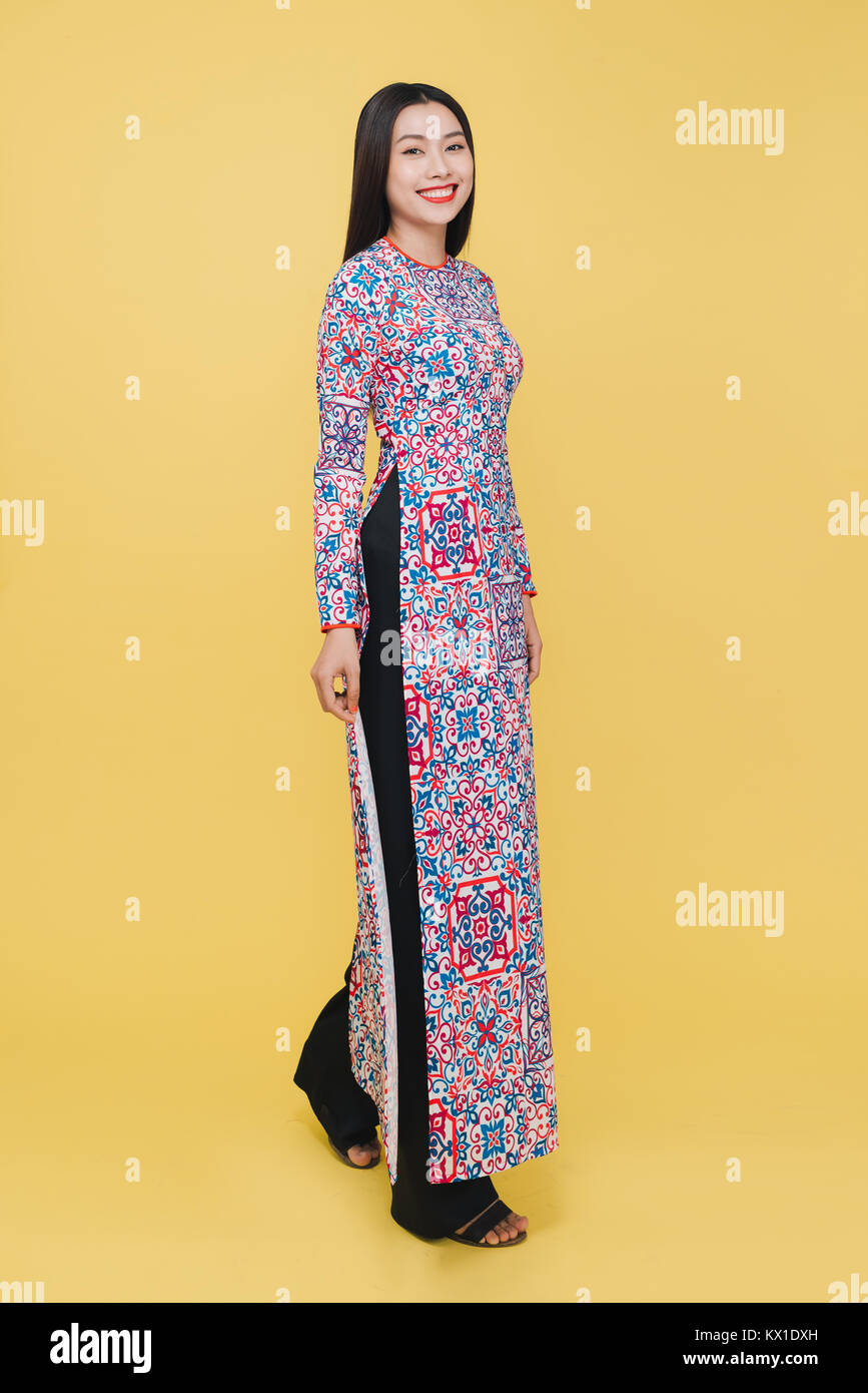 Attractive Vietnamese woman wearing traditional costume, isolated on ...