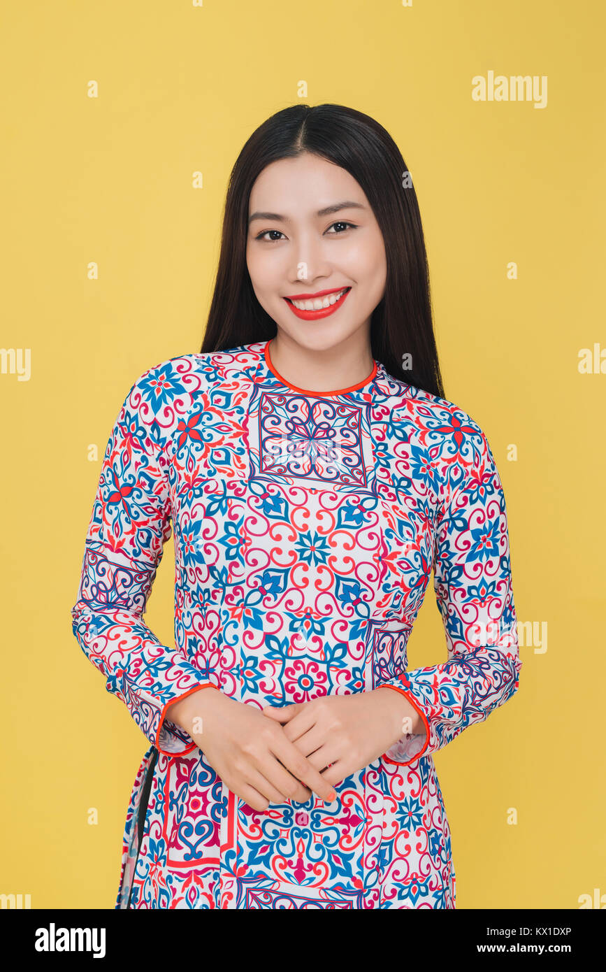 Attractive Vietnamese woman wearing traditional costume, isolated on ...