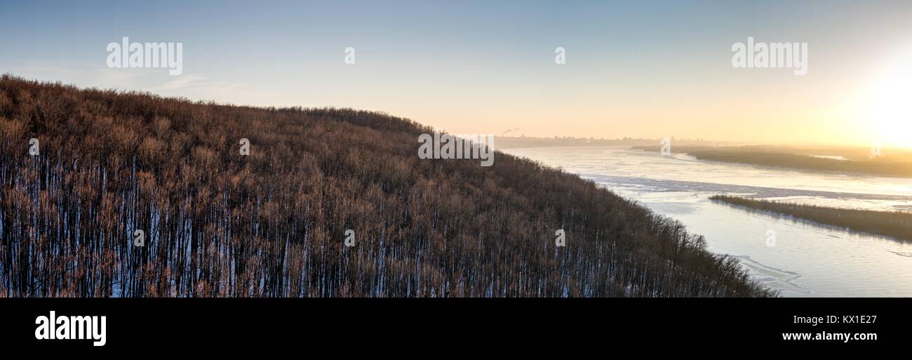 Panoramic view on frozen Volga river in winter during sunset from hill ...