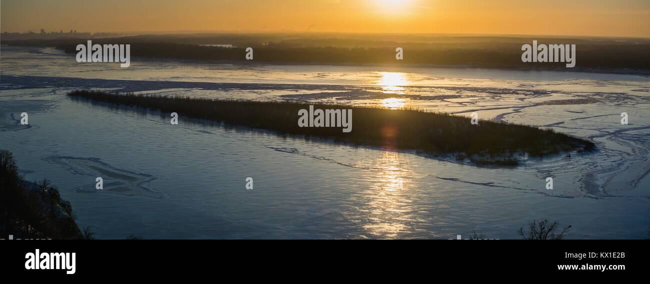 Panoramic view on frozen Volga river in winter during sunset from hill ...