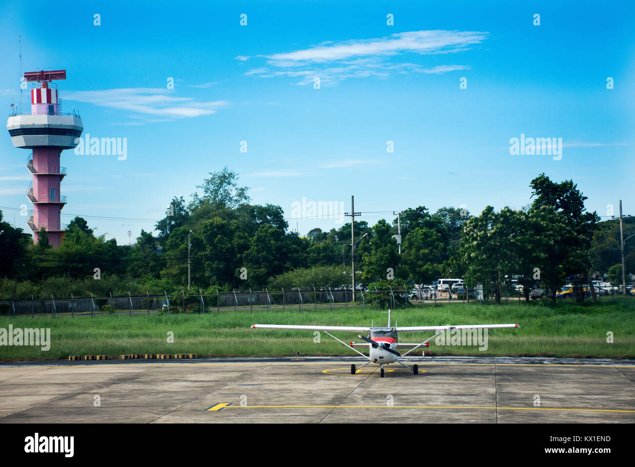 Air Traffic Control tower and Small plane stop on runway at Ubon ...