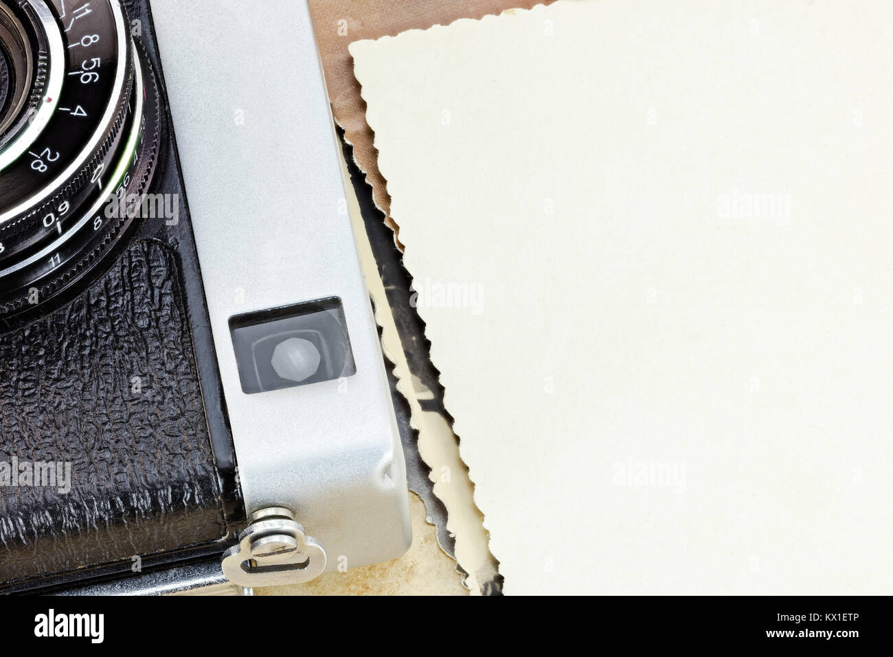 classic camera with old photos on grunge paper background Stock Photo ...