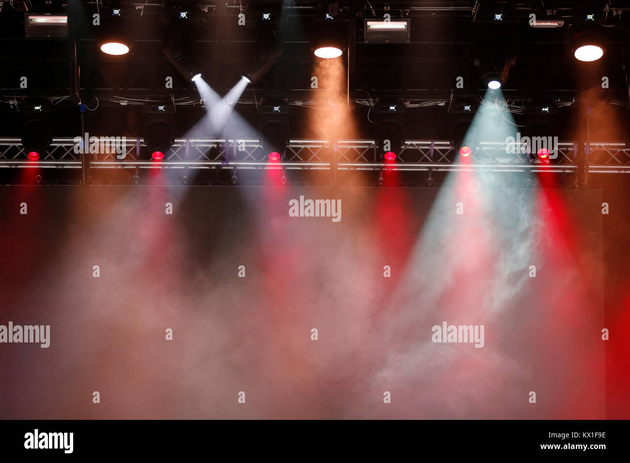 Concert spotlights.Concert spotlights.Red and white rays of powerful ...