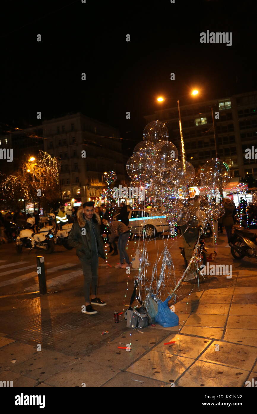 Athens, Greece. 30th Dec, 2017. A man selling see-through balloons.A ...