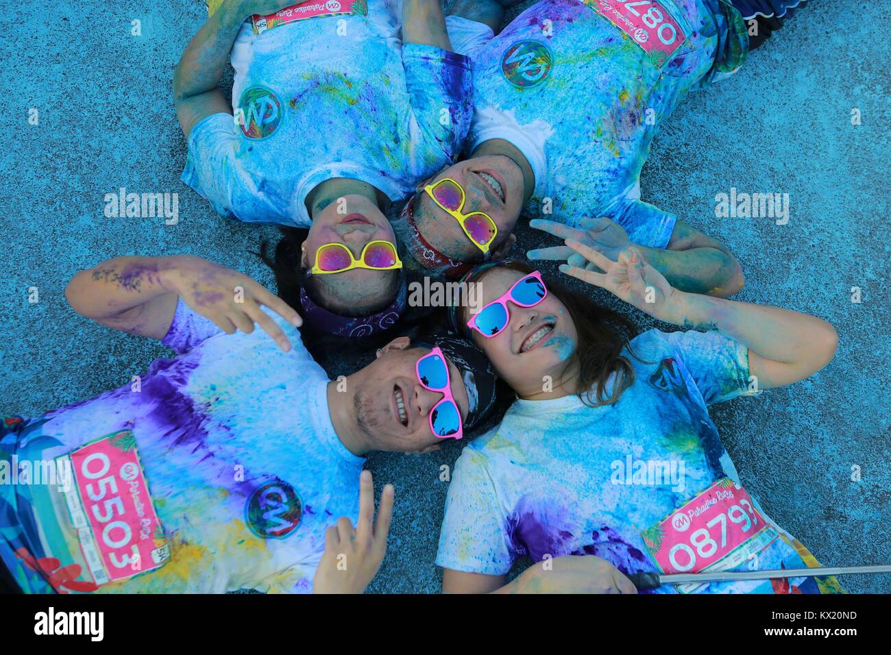 Pasay City, Philippines. 7th Jan, 2018. Runners lie on the colored ...