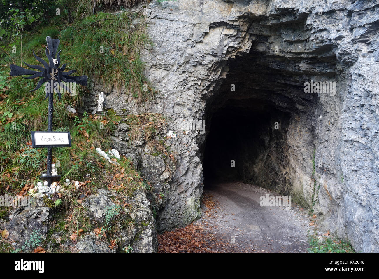 Metal cross near the enytance of tinel in mountain, Switzerland Stock ...