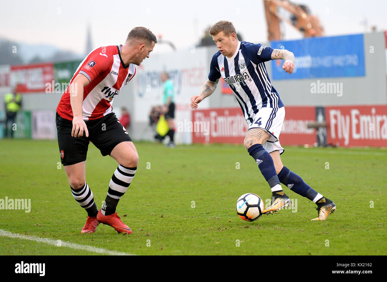 Exeter City's Pierce Sweeney (left) and West Bromwich Albion's James ...