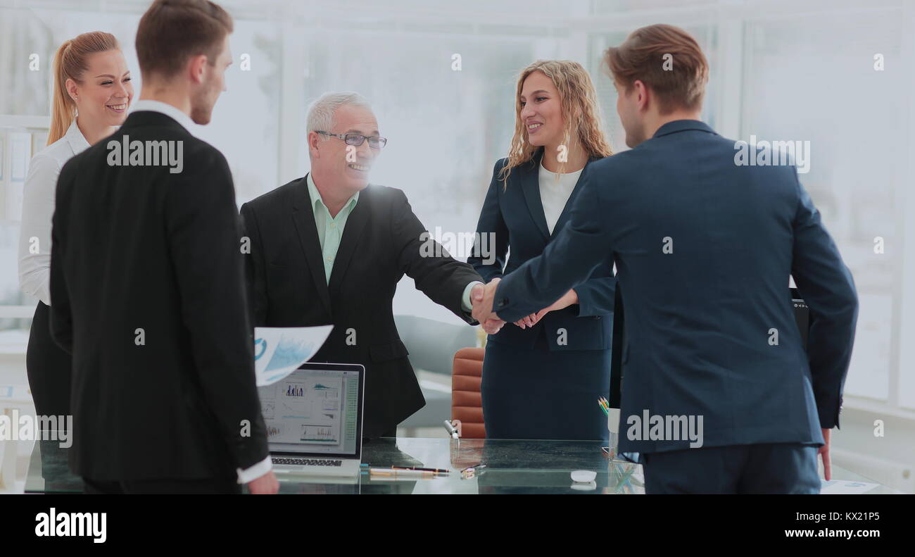 Business partners shaking hands after a successful transaction Stock ...