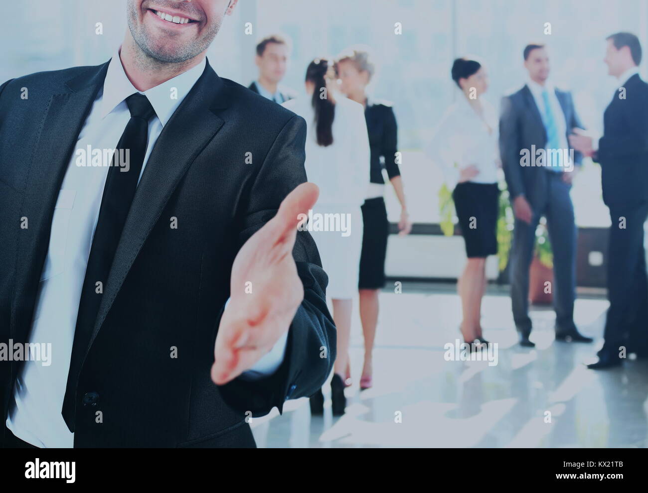 Portrait of a successful businessman giving a hand Stock Photo - Alamy