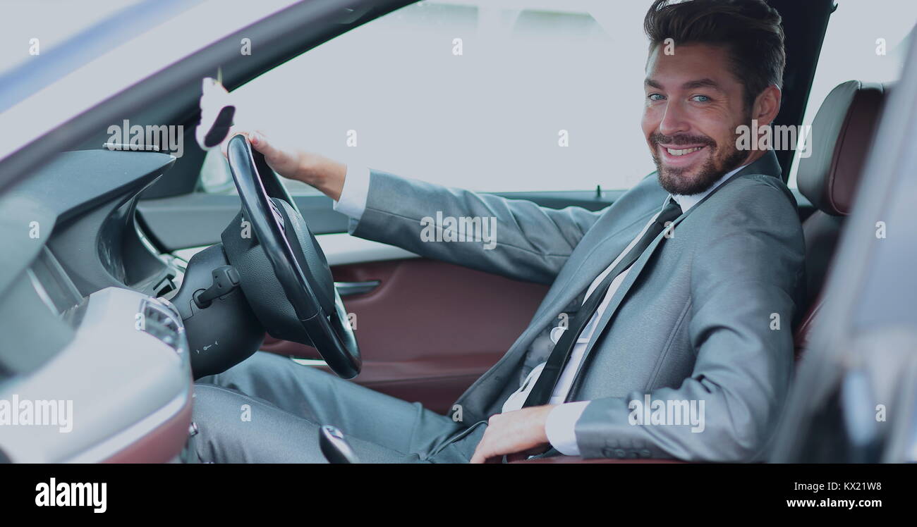 Portrait of a handsome successful business man driving his car Stock ...
