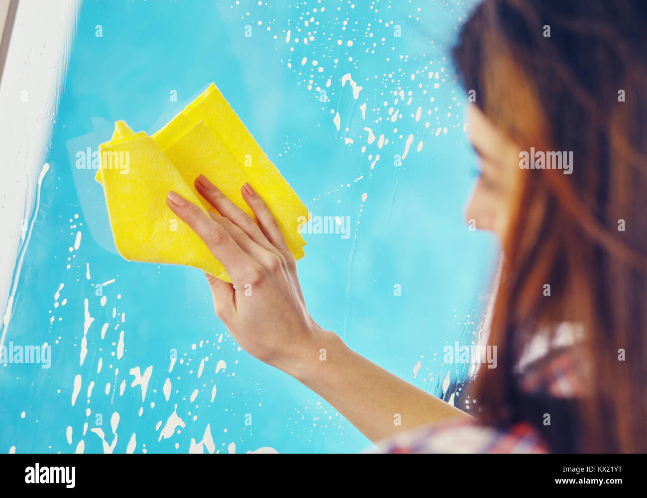 Woman Washing the Window with spray and rag Stock Photo - Alamy